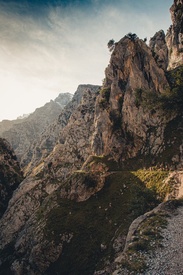 Path between the Rocky Mountains with the Walls Filled with Green Grass ...