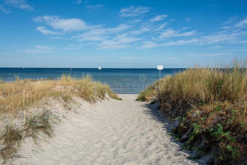 Path between the Sand Dunes Overlooking the Sea and a Ship Stock Image ...