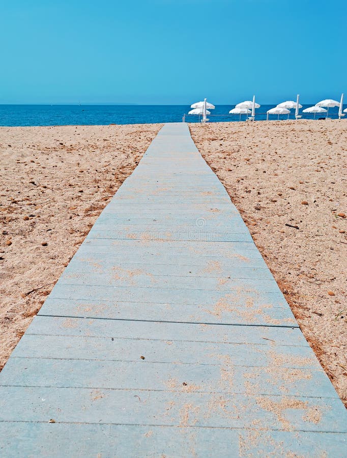 Path on the sand stock image. Image of umbrella, coast - 32005231