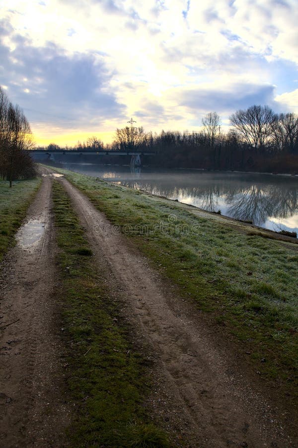 Path by the Shore of a River in the Italian Countryside in Winter Stock ...