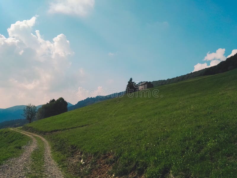 Path on the side of a hill stock photo. Image of property - 76405412