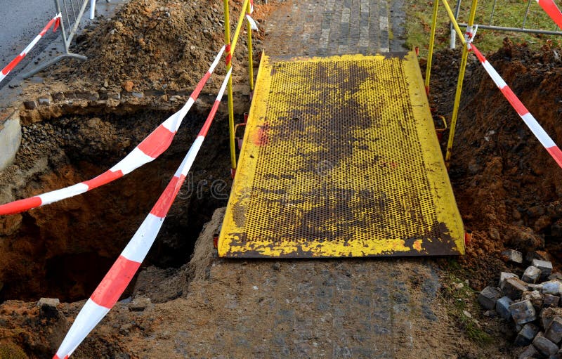 The Path of the Sidewalk is Interrupted by Excavation of a Gutter for ...