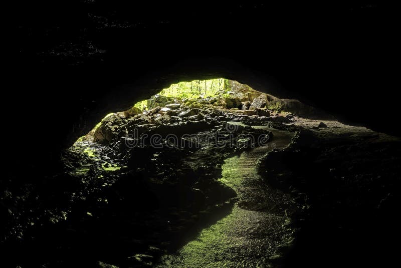 Path To Cave Exit stock photo. Image of cave, rock, green - 71990956