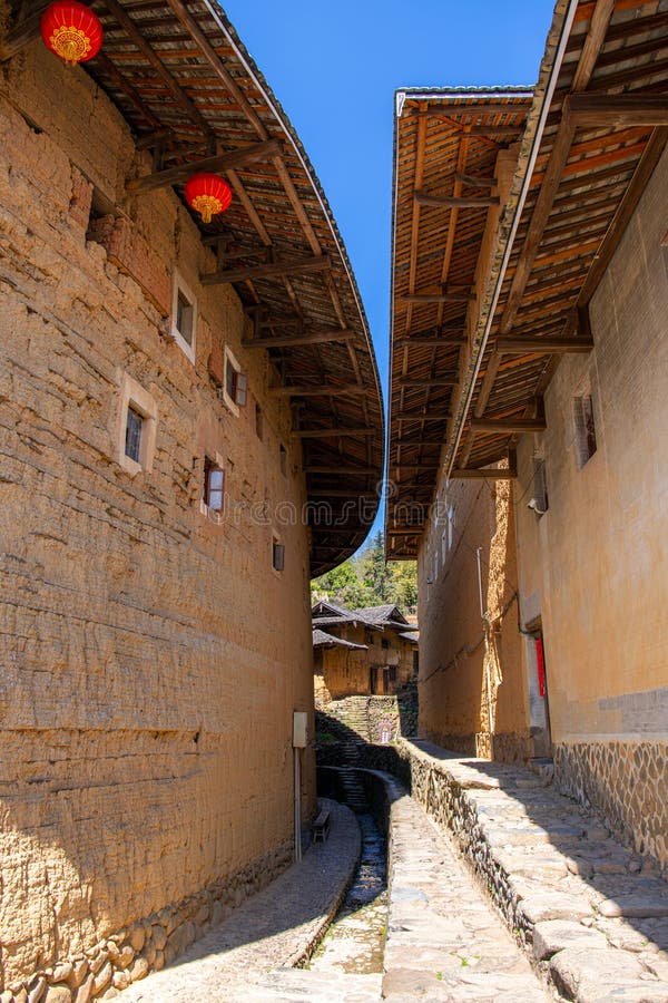 The Path between Two Tulou Mud Buildings with a Blue Sky, Fujian, China ...