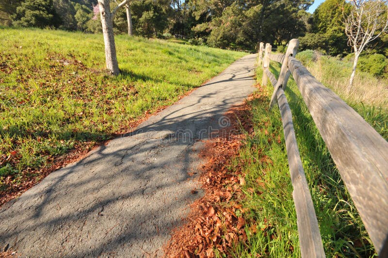 Path with a Wooden Fence and Trees Stock Image - Image of trees, leaves ...