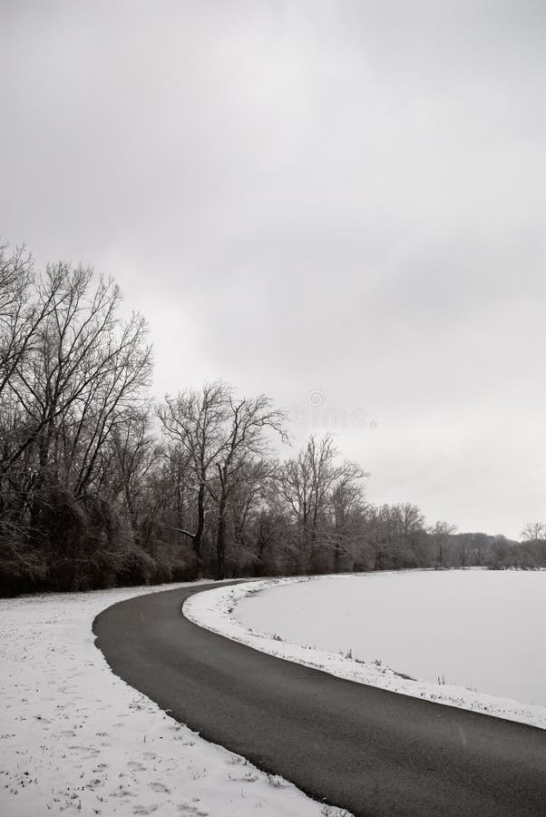 Pathway around frozen lake stock photo. Image of cloudy - 7891386