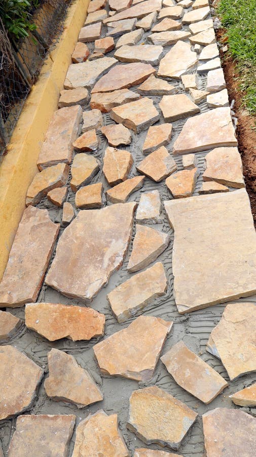 Pathway is Being Constructed with Uneven, Natural Stone Tiles, Placed ...