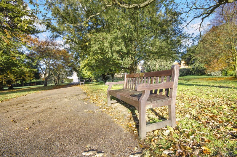 Pathway Bench in a Public Park Stock Image - Image of city, flowers ...