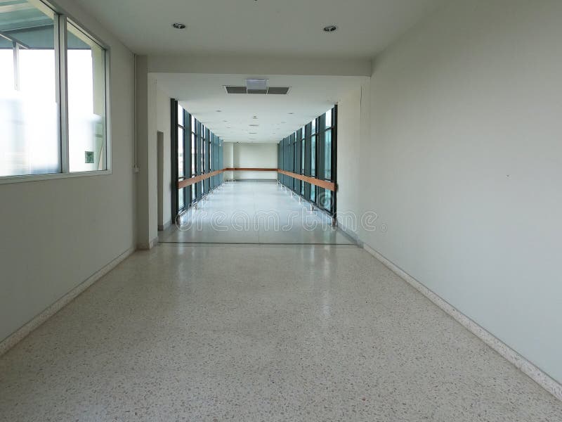 Pathway with Concrete and Glass Wall of a Building Stock Photo - Image ...