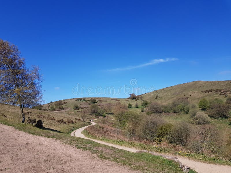 Pathway between Hills Blue Sky Stock Photo - Image of plain, grass ...