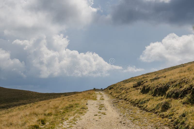 Pathway between Mountains with a View. Stock Photo - Image of track ...