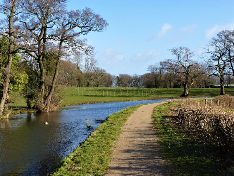 A pathway next to a canal stock image. Image of pathway - 196718305