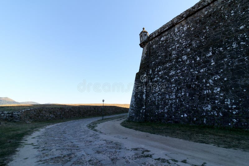 Pathway Next To the High Stone Wall of an Old Castle Under the Blue Sky ...