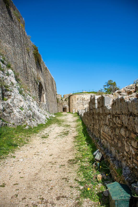 Pathway between Old Stone Walls Under Blue Sky Stock Photo - Image of ...