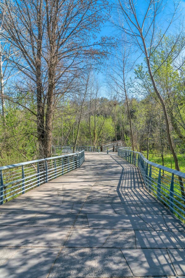 Pathway with Railings in the Middle of Trees and Fields at Austin ...