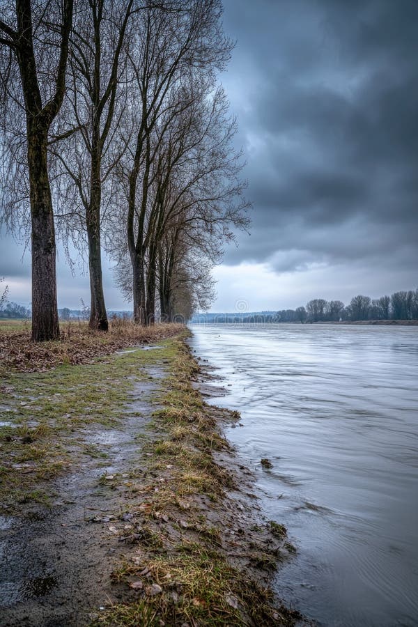 Pathway by River on Cloudy Day Stock Photo - Image of river, pathway ...