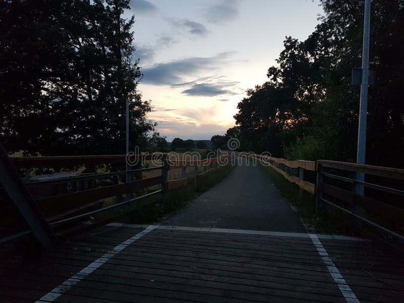 Pathway To Sunset between Trees Stock Image - Image of pathway, trees ...