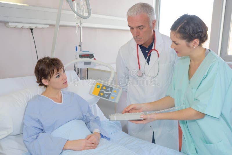 Patient Being Ask for Signature Stock Image - Image of professional ...