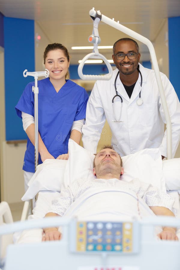 Patient Being Wheeled in Hospital Bed Stock Image - Image of medicine ...