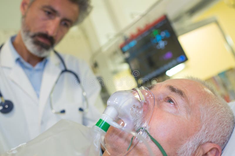 Patient on breathing mask stock image. Image of mask - 99254737