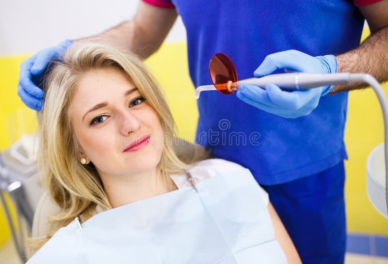 The Patient Caring for Teeth in the Dental Clinic Stock Photo - Image ...