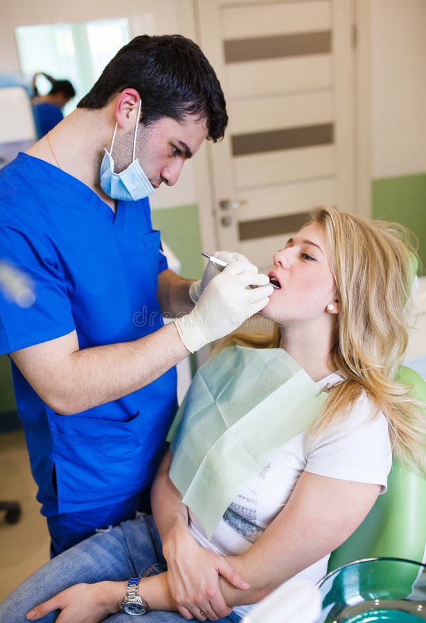 The Patient Caring for Teeth in the Dental Clinic Stock Photo - Image ...