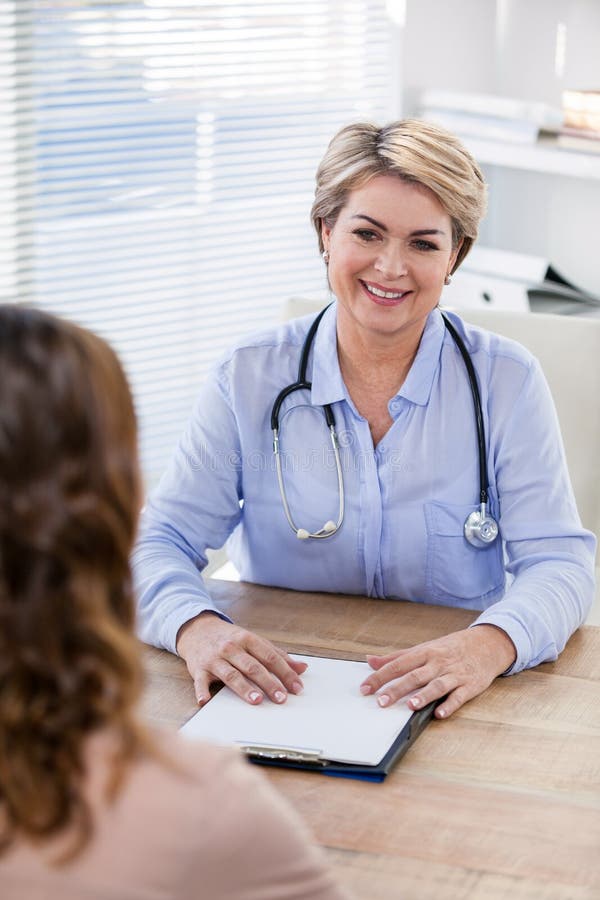 Patient Consulting a Doctor Stock Photo - Image of cheerful, clinic ...