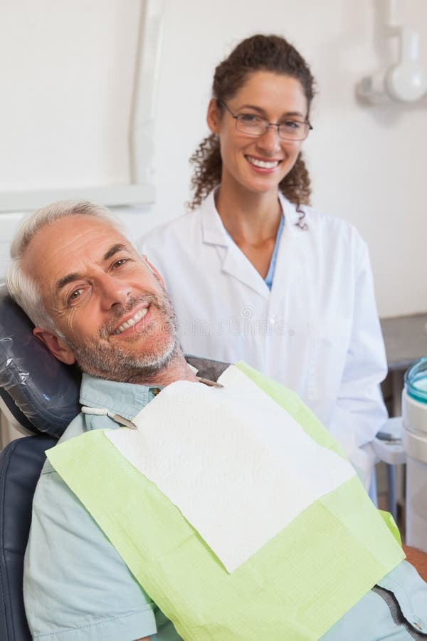 Patient and Dentist Smiling at Camera Stock Photo - Image of mature ...