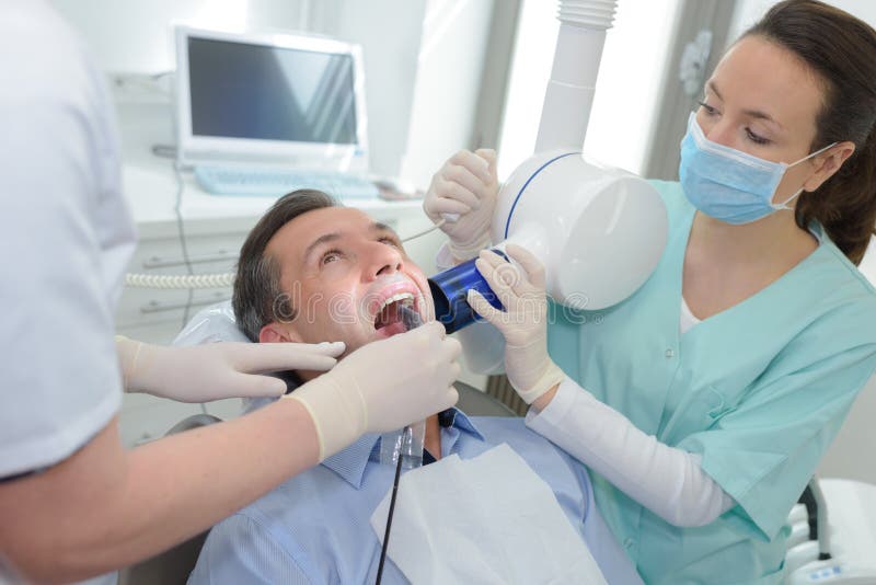 Patient in Dentists Panoramic and Cephalometric X-ray System Stock ...