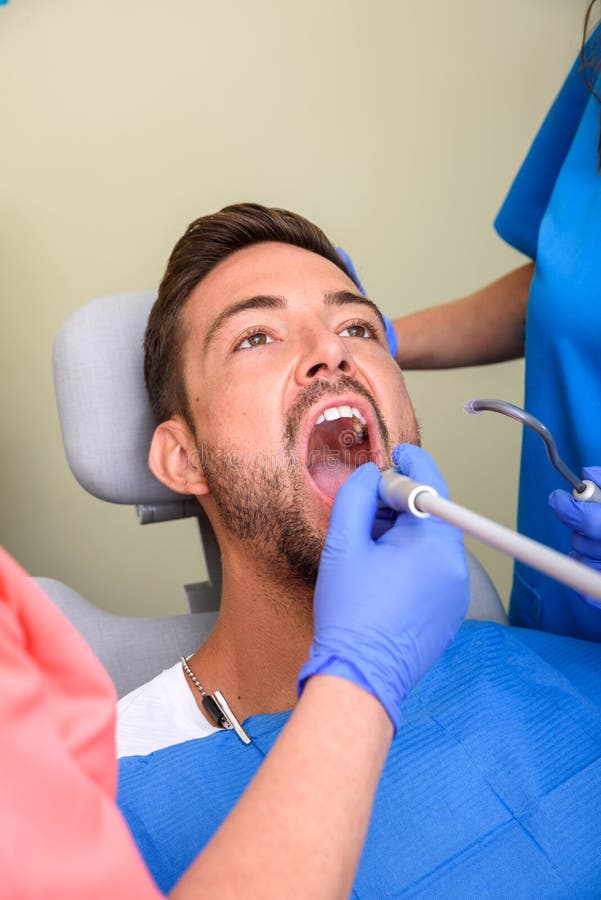 A Patient Getting Attended and Treatment in a Dental Studio Stock Image ...
