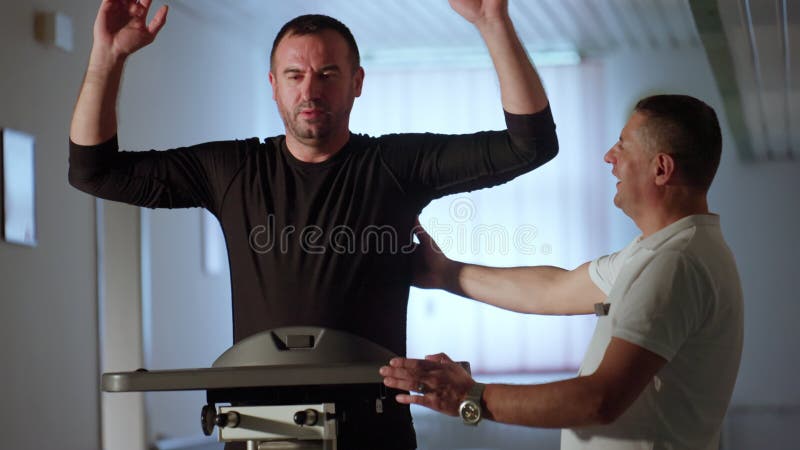 Patient, Guided by a Physiotherapist, Performs Arm Mobility Exercises ...