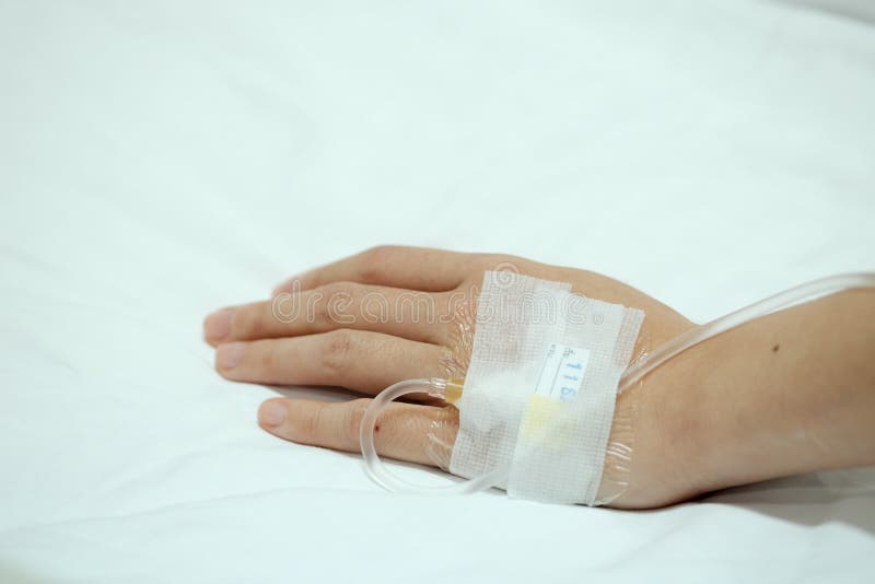 Patient Hand Injected with Saline IV Drip on Hospital Bed Stock Photo ...