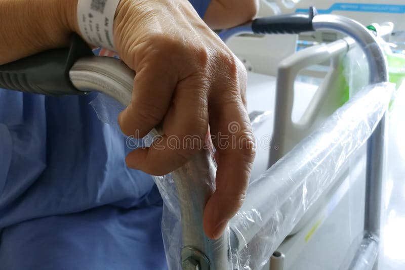 Patient hand on a walker. stock photo. Image of medical - 121343982