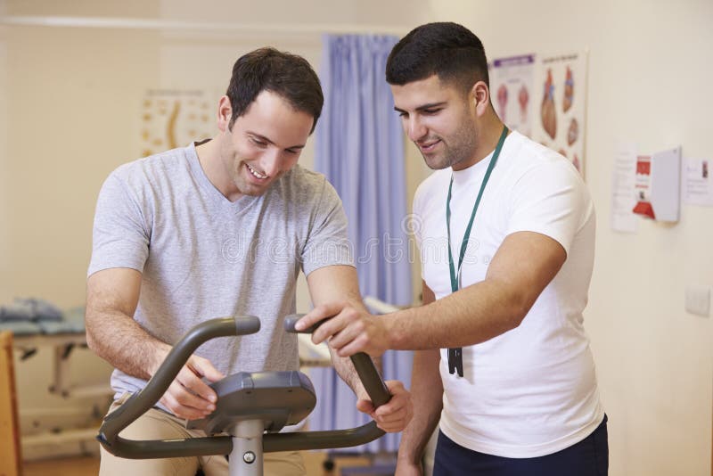 Patient Having Physiotherapy on Exercise Bike in Hospital Stock Image ...