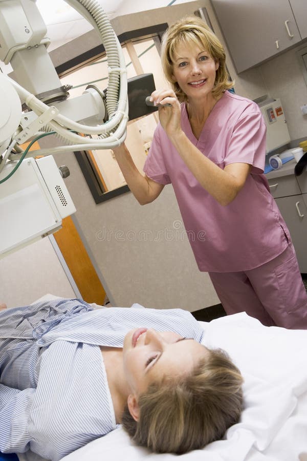 Nurse Monitoring Patient Having CAT Scan Stock Photo - Image of gown ...