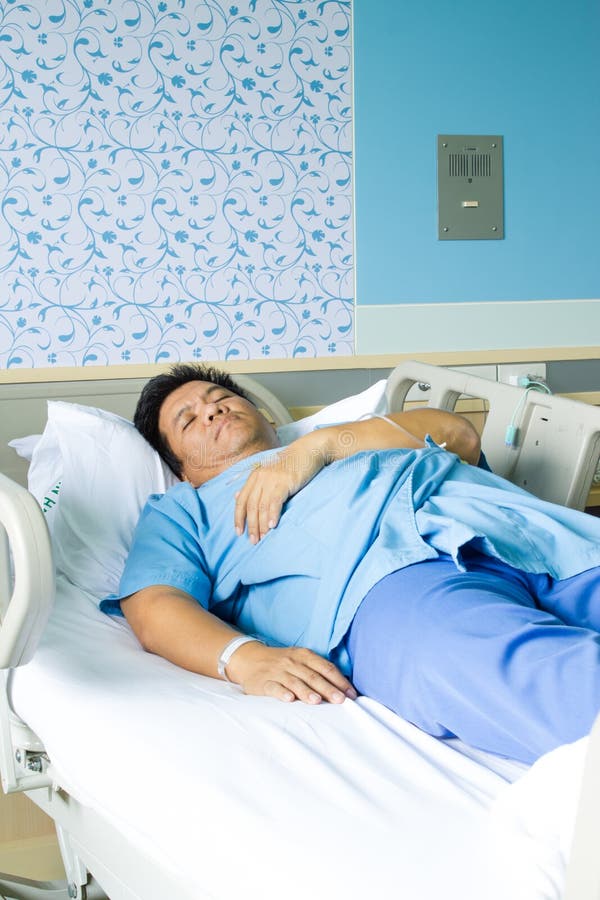 Patient in hospital bed stock image. Image of assistance - 40134199
