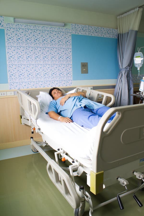 Patient in hospital bed stock photo. Image of assistance - 40134186