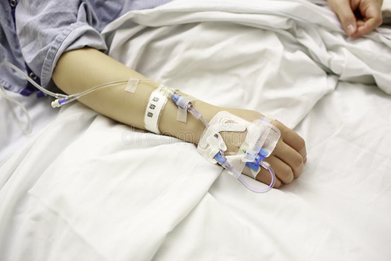 Patient with IV Lines in Hospital Bed Stock Photo - Image of treatment ...