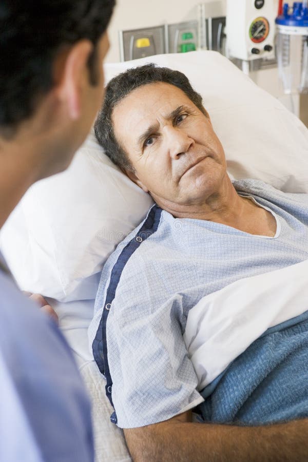 Patient Looking at Doctor stock image. Image of illness - 6431165