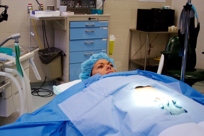 Patient in operating room stock image. Image of surgery - 35740371