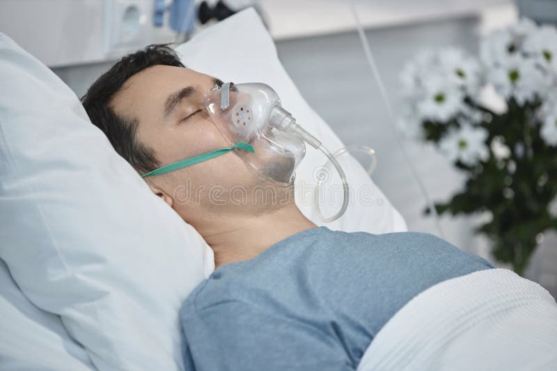 Patient with Oxygen Mask Lying in Hospital Ward Stock Image - Image of ...