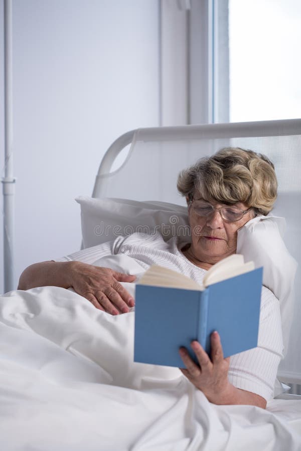 Patient reading a book stock image. Image of occupation - 59517641