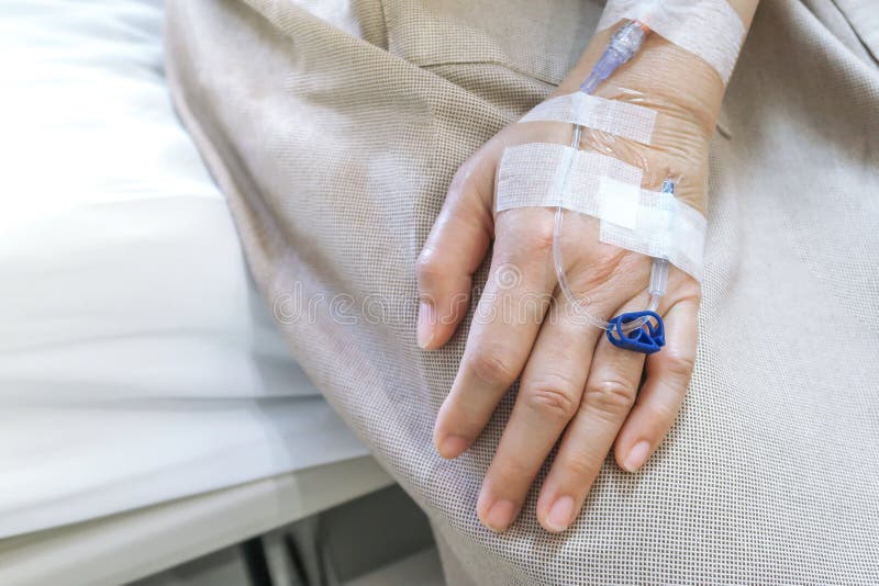 Patient`s Hand with Drip Receiving a Saline Solution Stock Image ...