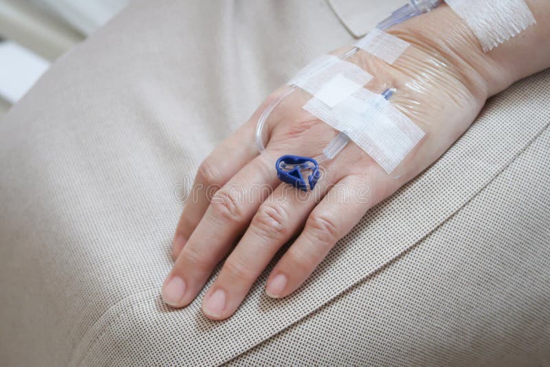 Patient`s Hand with Drip Receiving a Saline Solution. Stock Image ... Patient`s Hand with Drip Receiving a Saline Solution. Stock Image ...