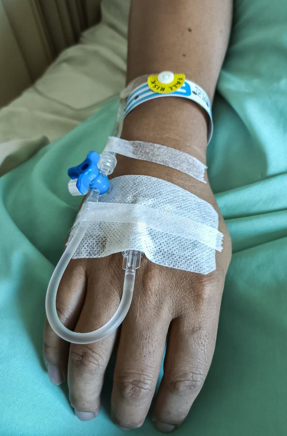 A Patient`s Hand in a Hospital Were Connected To the Saline Solution ...
