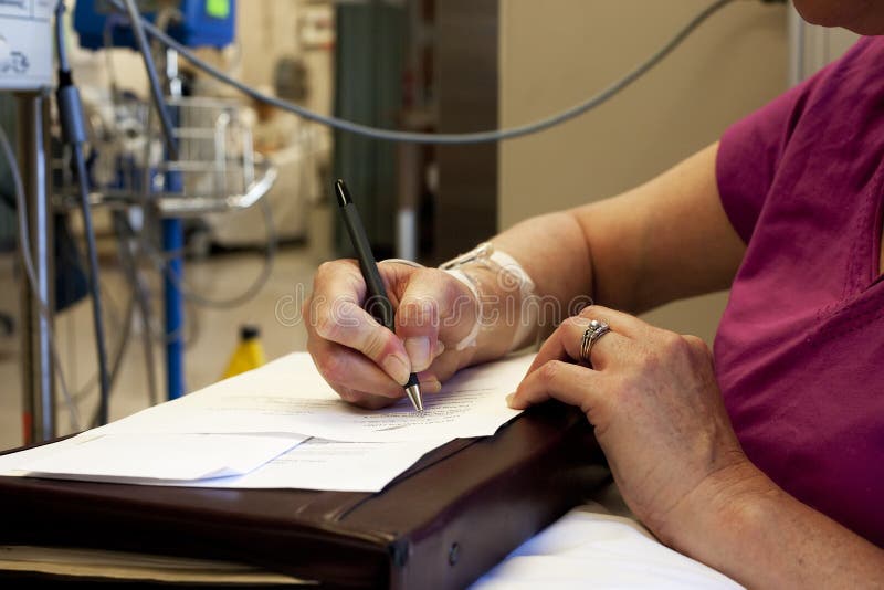 Patient Signing Documents during Treatment Stock Photo - Image of ...