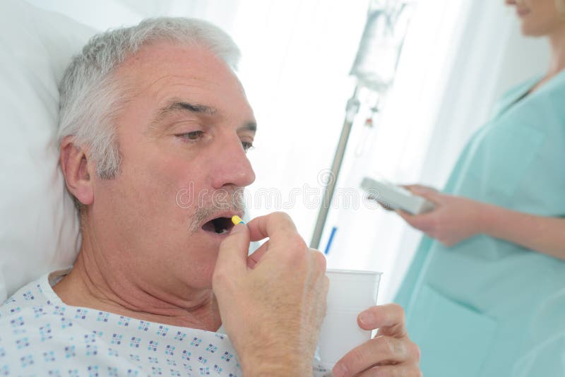 Patient taking his pill stock photo. Image of mature - 198492832