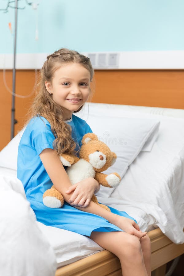 Patient with Teddy Bear Sitting on Bed in Hospital Stock Photo - Image ...