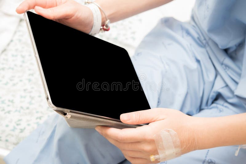 Patient Using Computer Tablet in Hospital Stock Image - Image of ...
