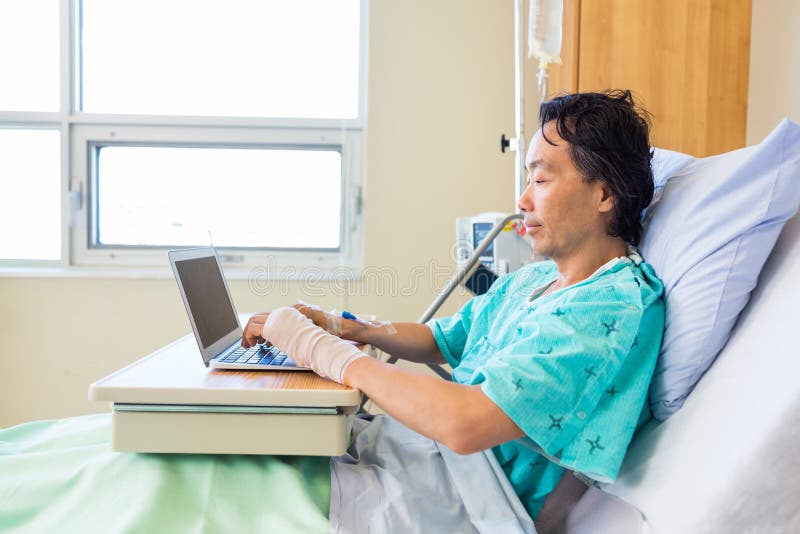 Patient Using Laptop on Bed in Hospital Stock Photo - Image of ...